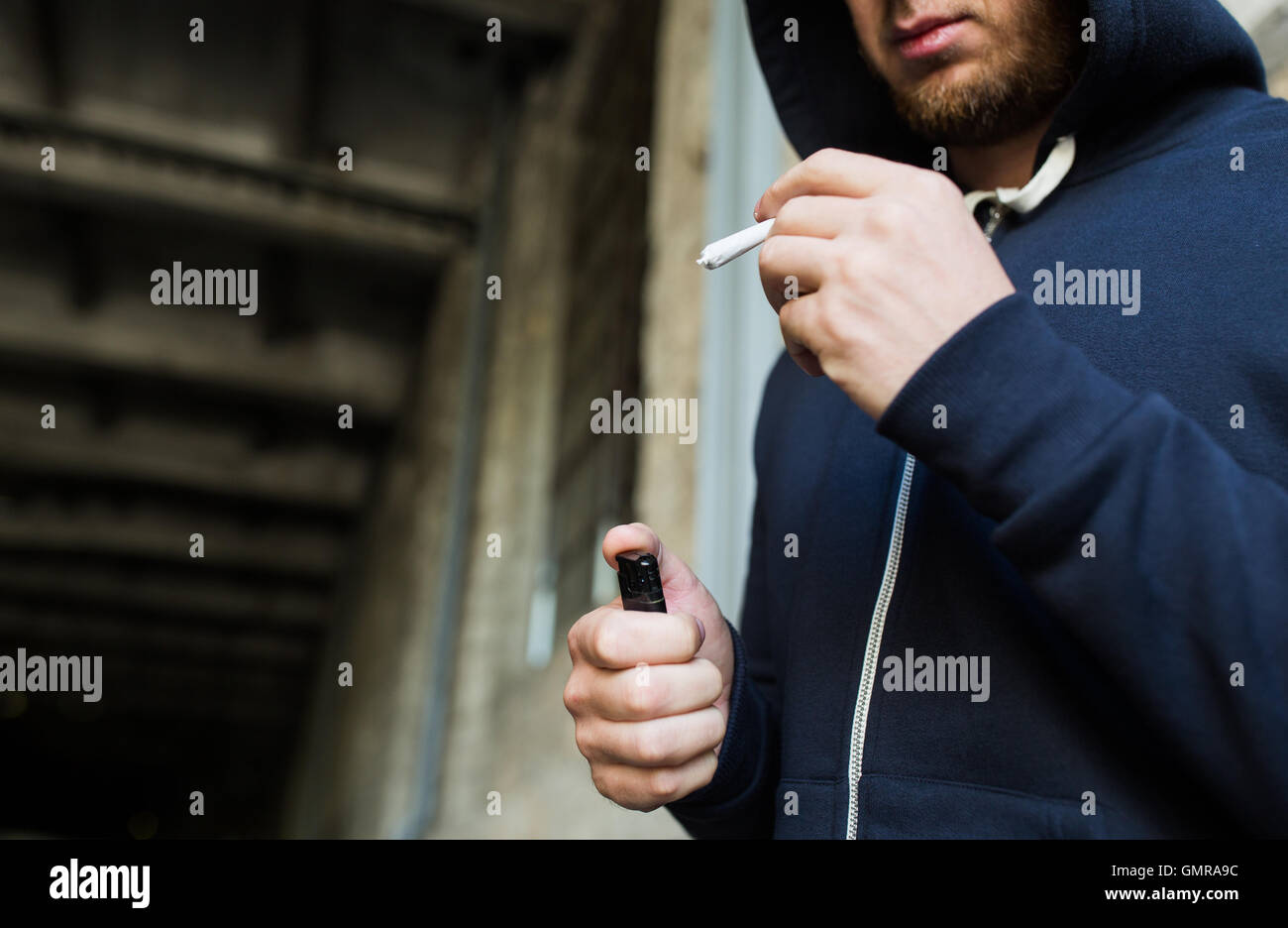 close up of addict hands with marijuana joint Stock Photo - Alamy