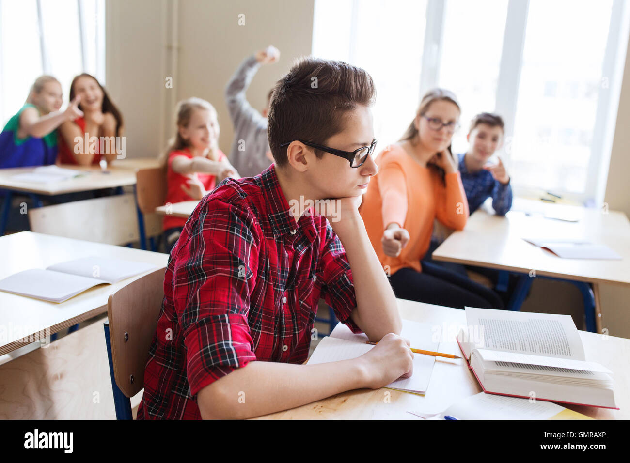 classmates laughing at student boy in school Stock Photo - Alamy