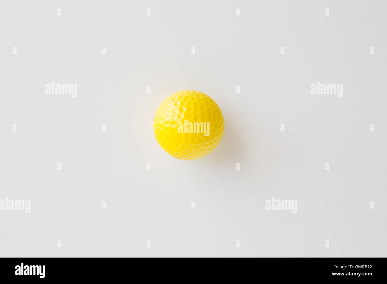 close up of yellow golf ball over white background Stock Photo - Alamy