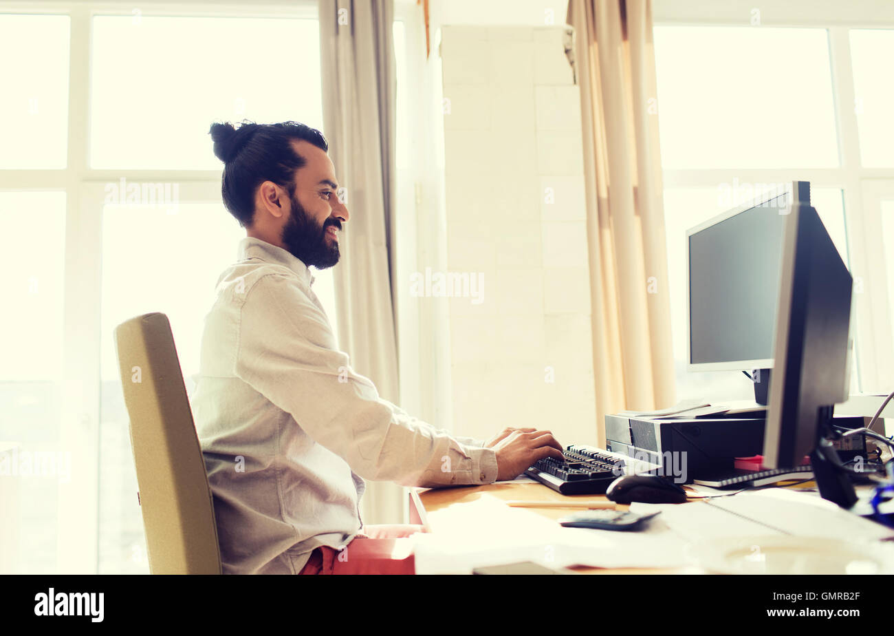 happy creative male office worker with computer Stock Photo - Alamy