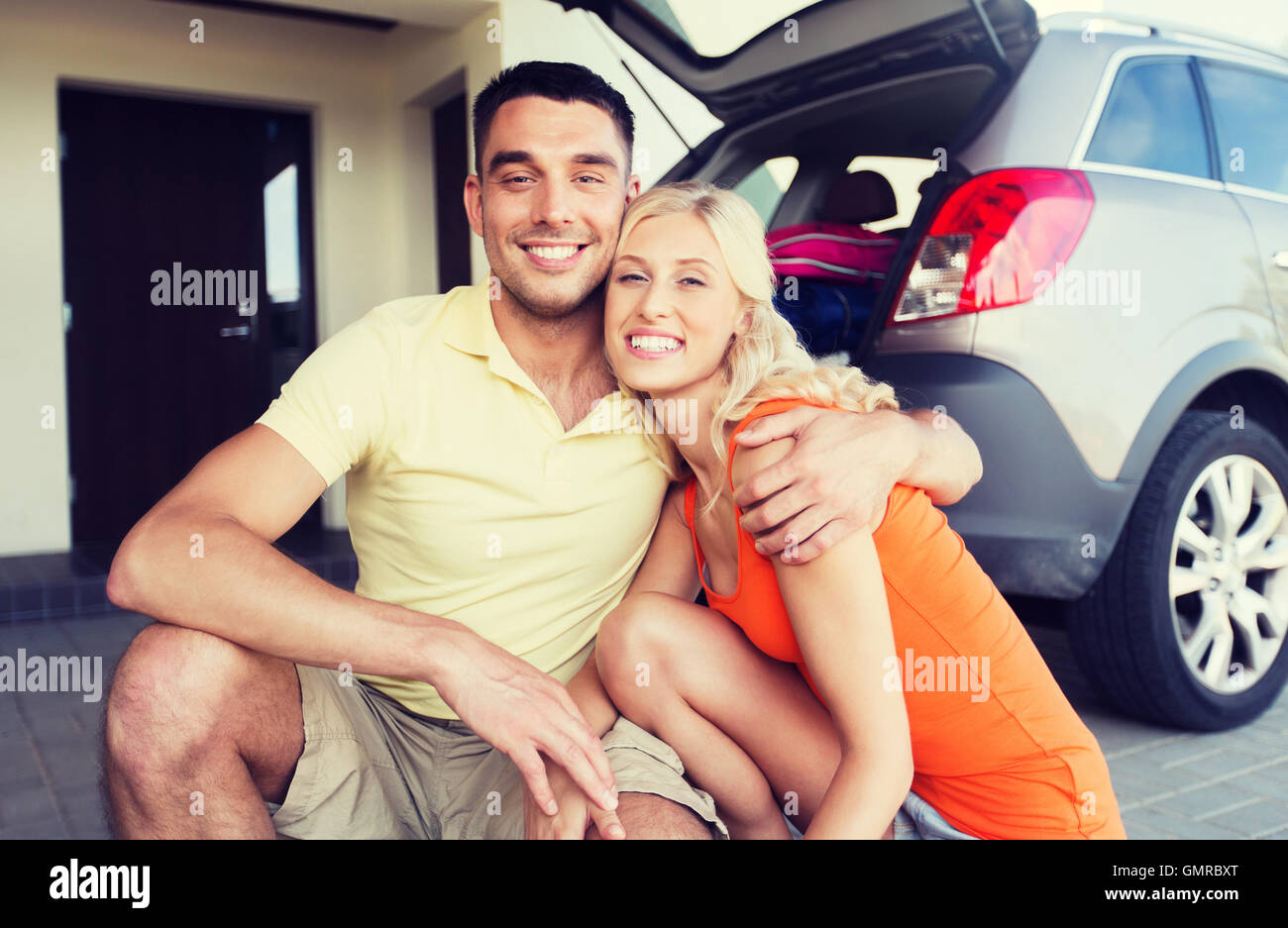 happy couple hugging at home car parking space Stock Photo - Alamy