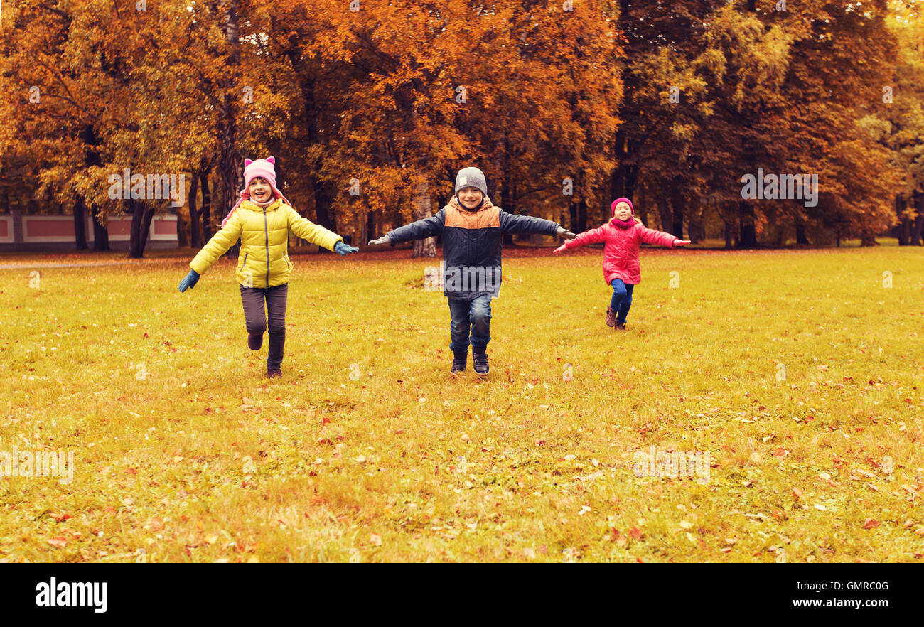 happy little children running and playing outdoors Stock Photo - Alamy