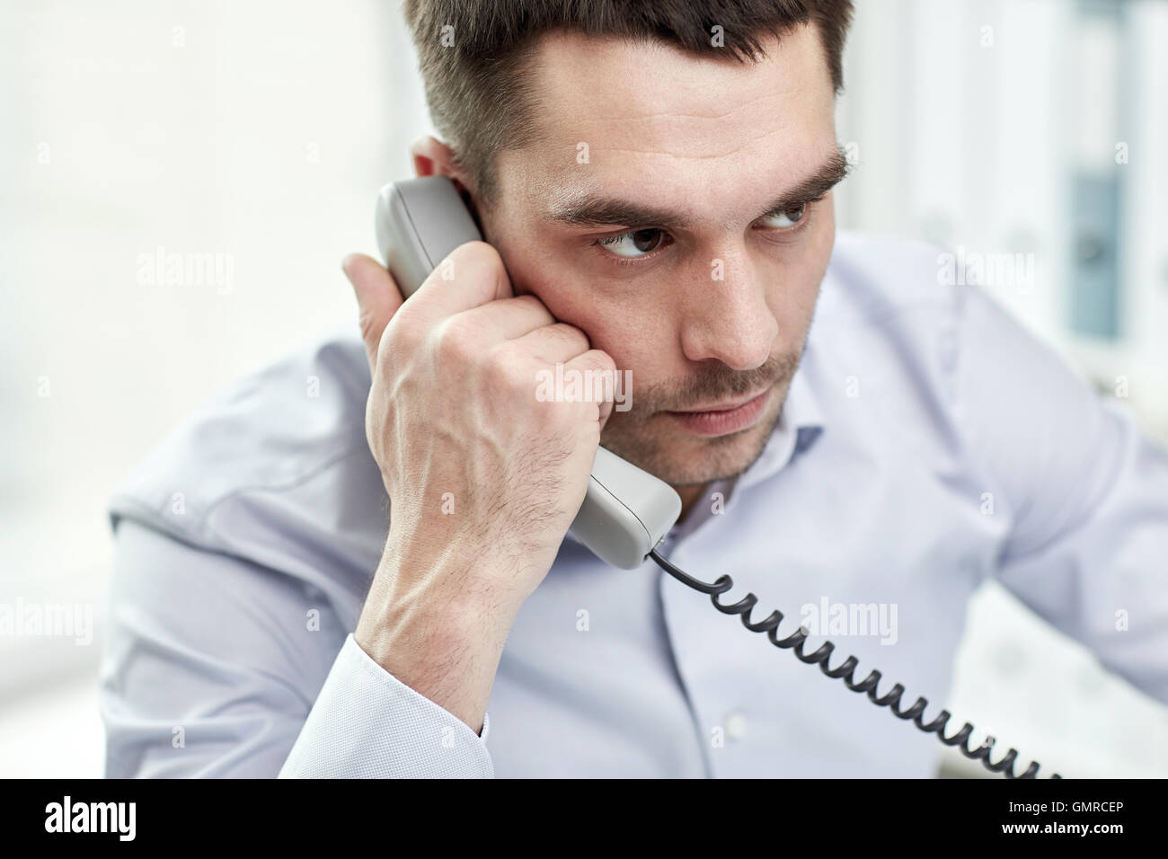 Angry man on phone hi-res stock photography and images - Alamy