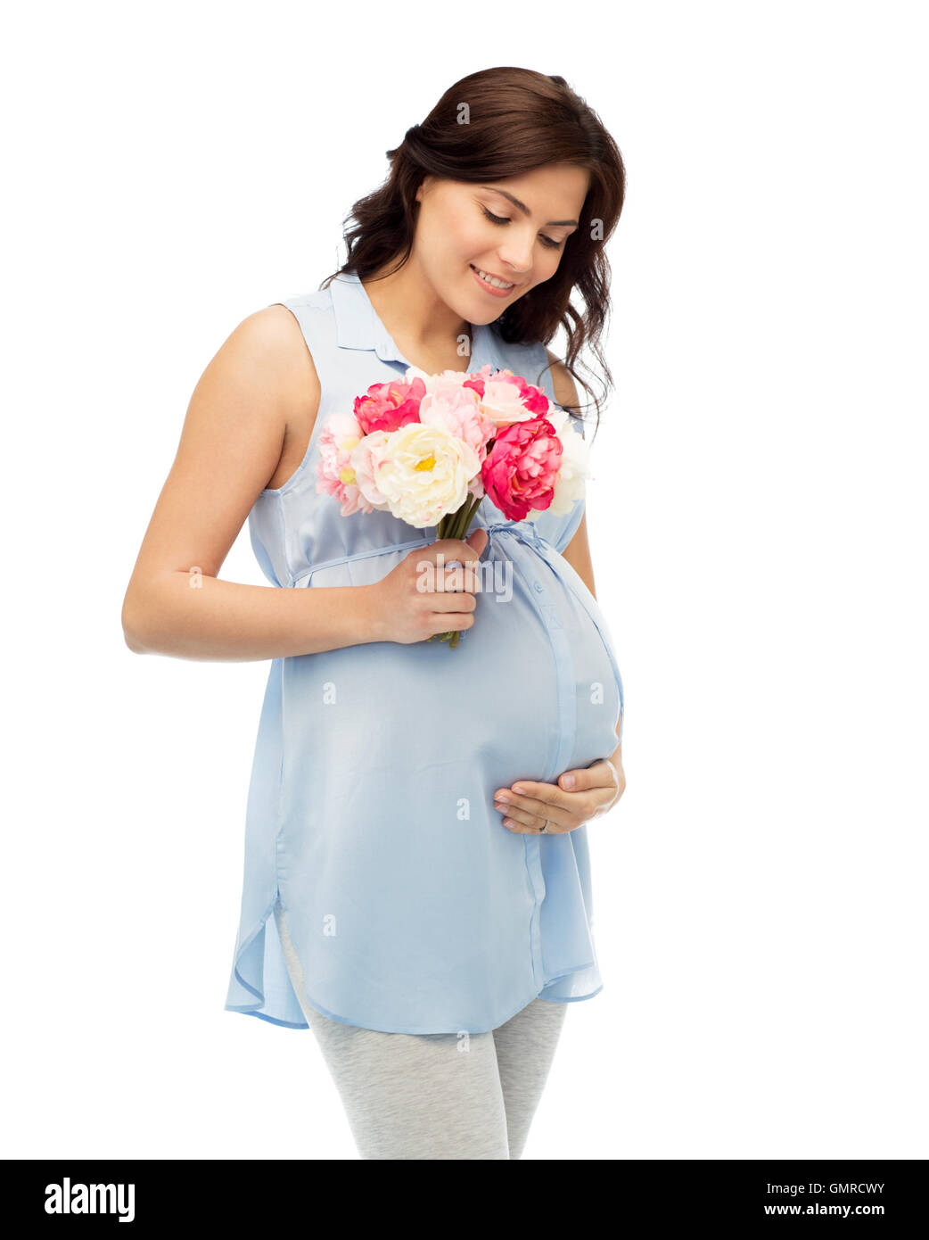 happy pregnant woman with flowers touching belly Stock Photo - Alamy