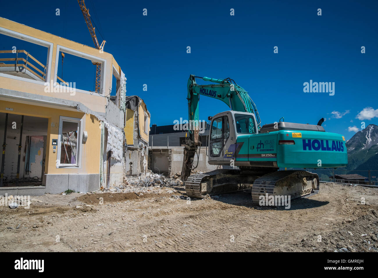 Building construction in progress with demolition of an old building ...