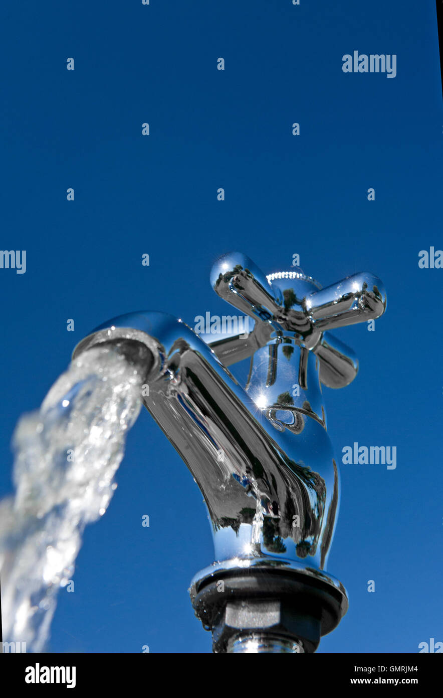 Fresh drinking water dripping and pouring from a tap Stock Photo - Alamy