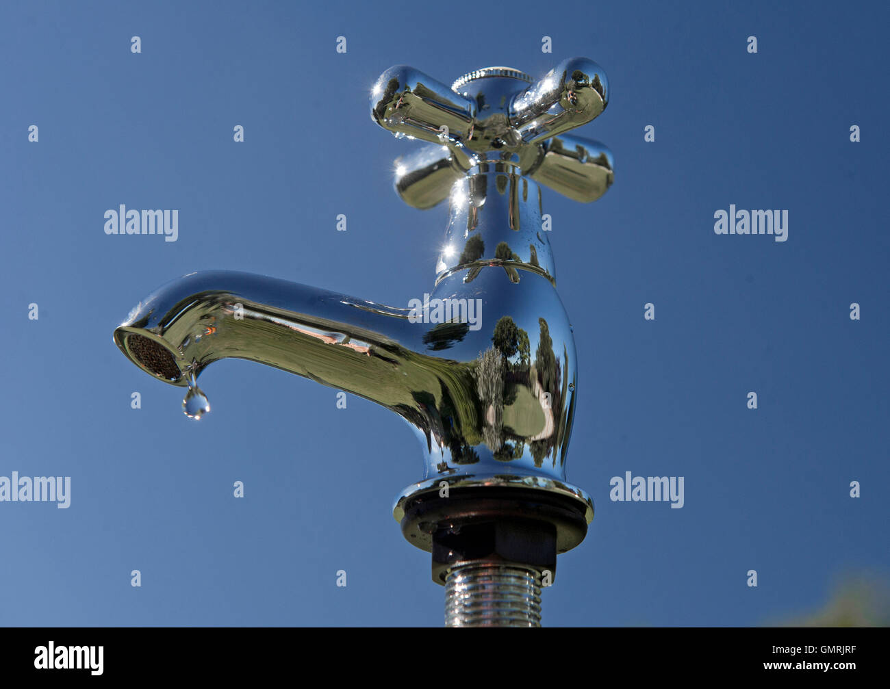 Fresh drinking water dripping and pouring from a tap Stock Photo - Alamy