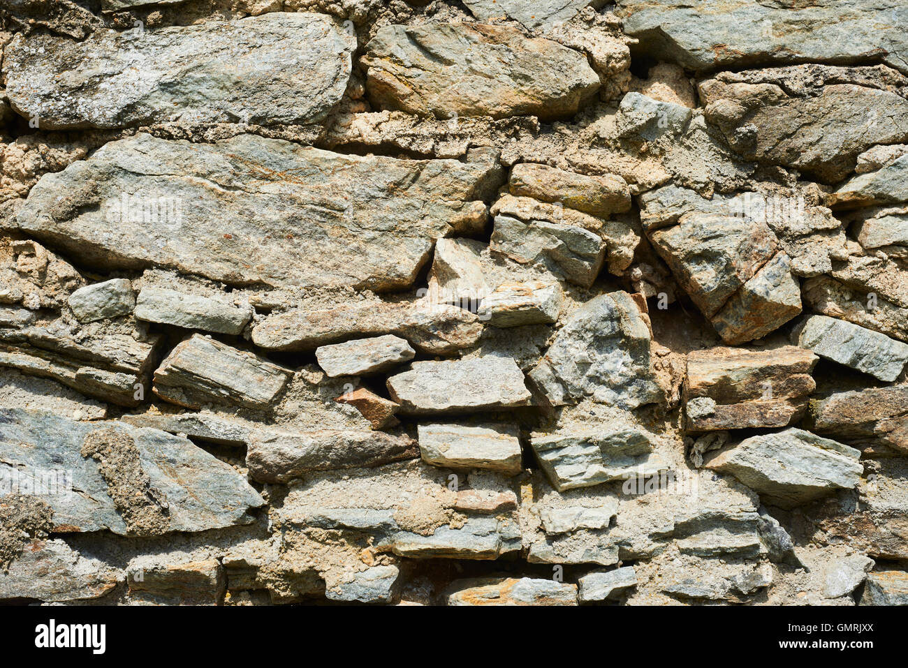 Weathered antique old cracked stone blocks wall retro background Stock ...