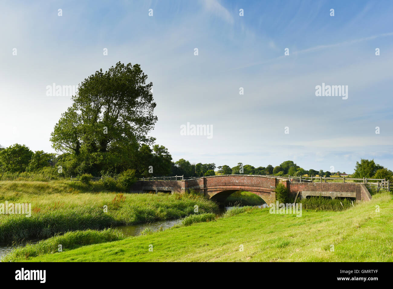 A brick bridge over the River Cuckmere, near Alfriston in East Sussex ...