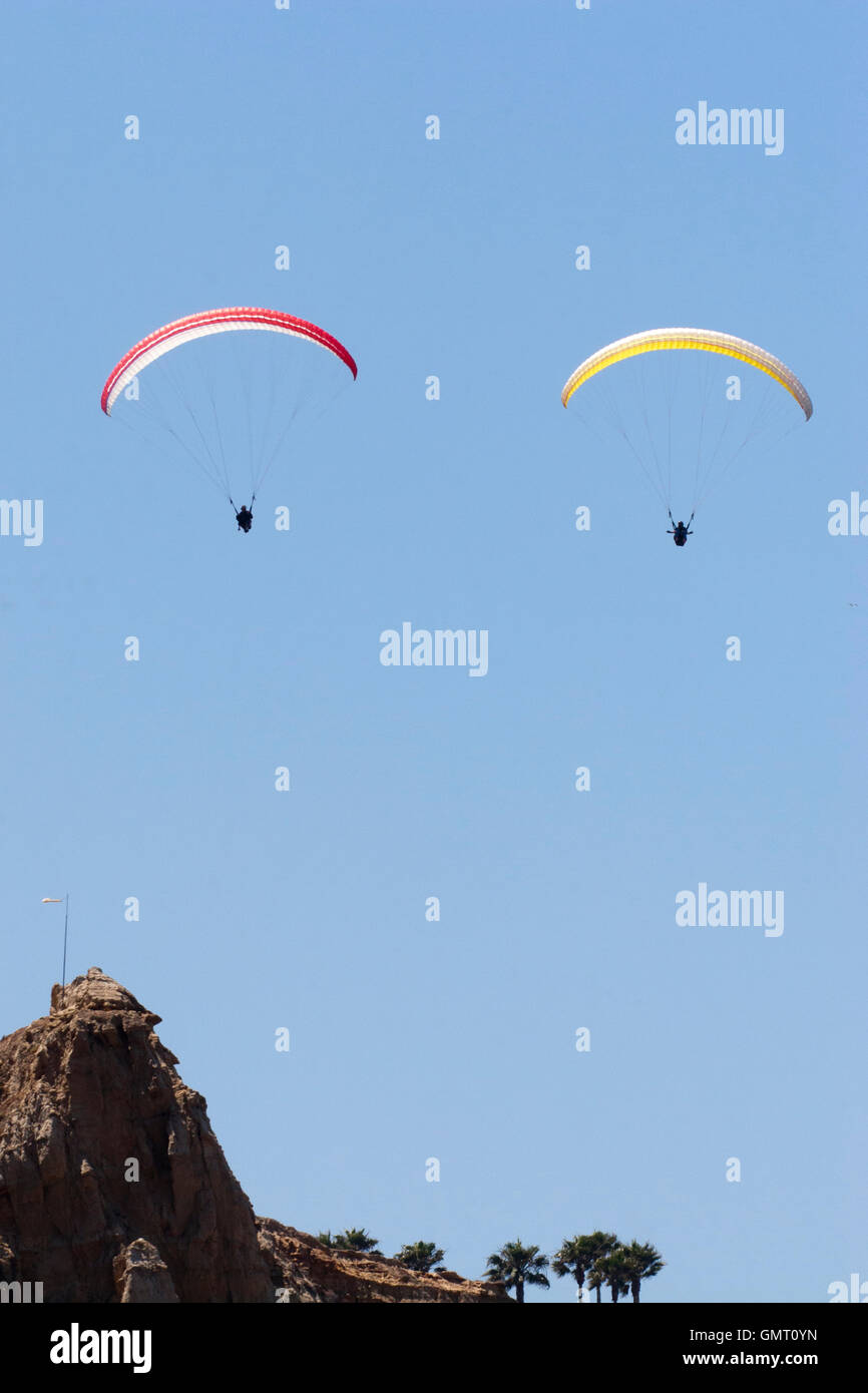 Two people paragliding over cliffs in San Diego, California Stock Photo ...