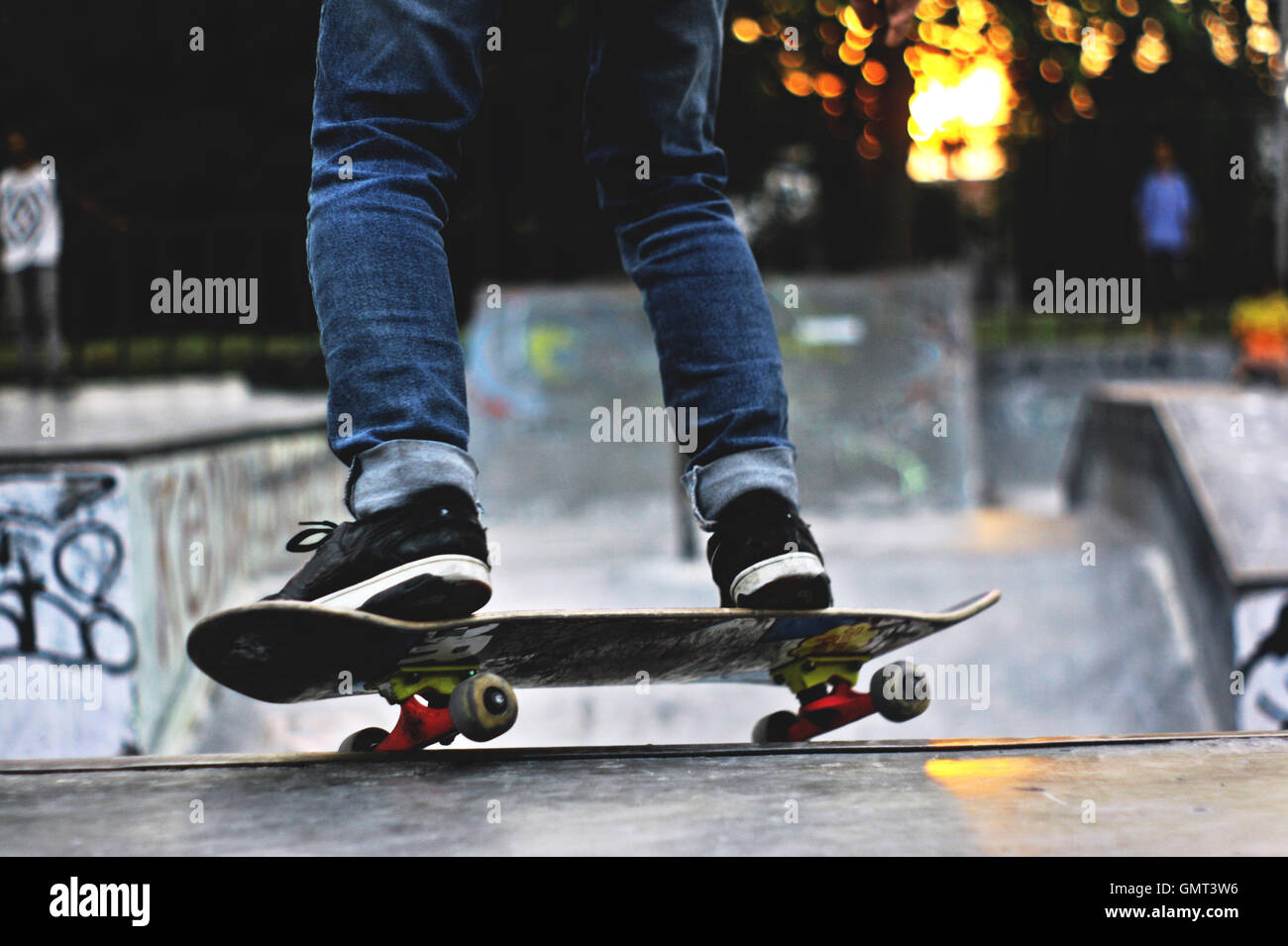 young man playing skateboard in the skate park Stock Photo - Alamy