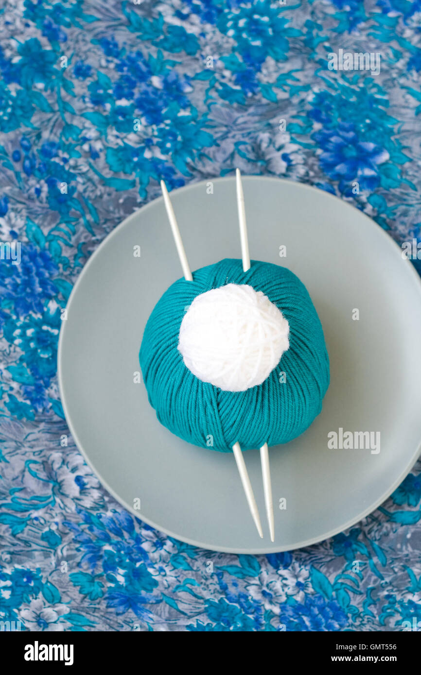 Two tangle of threads for knitting on the gray plate Stock Photo - Alamy