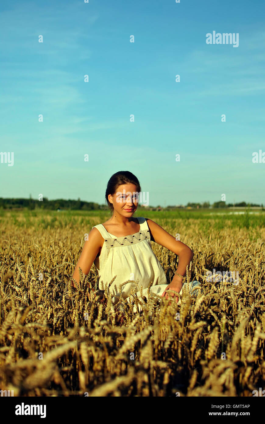 Girl in costume sitting in the Rye in the countryside Stock Photo - Alamy