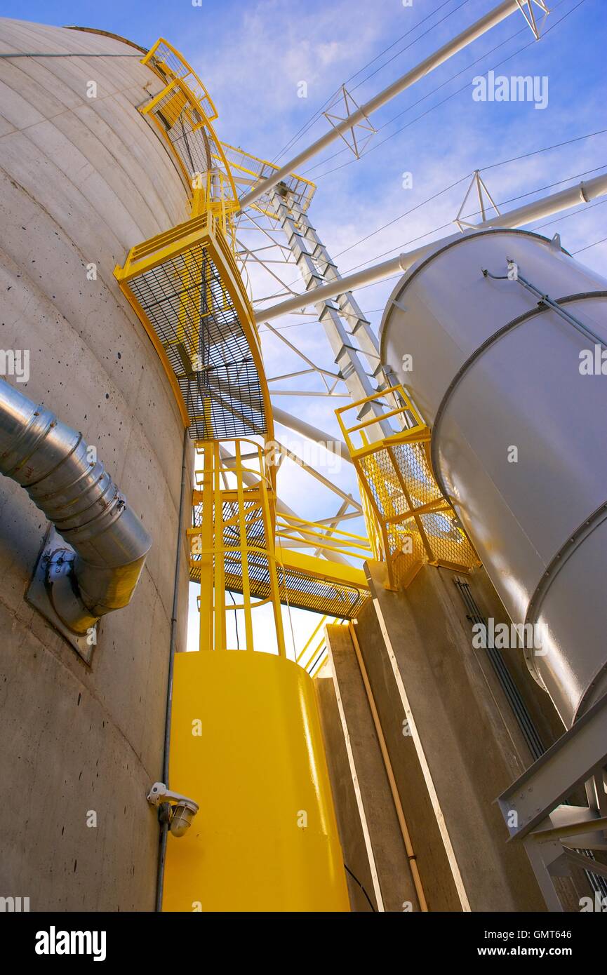 Grain Silos with Yellow Safety Areas Stock Photo - Alamy