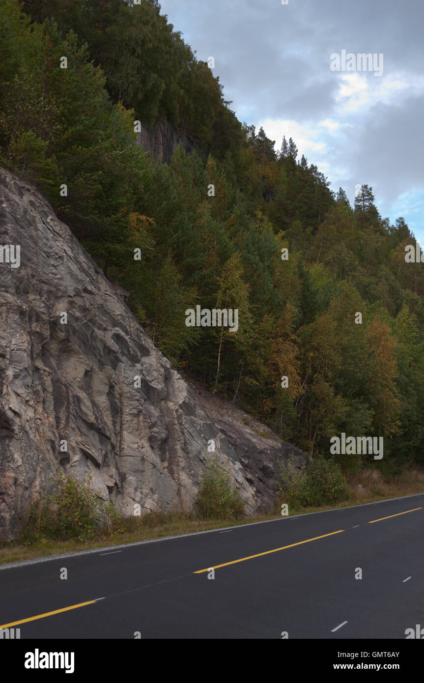 Rocks and woods near road Stock Photo - Alamy