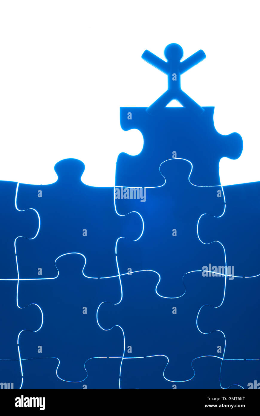Single person rise hands on top of puzzles Stock Photo - Alamy