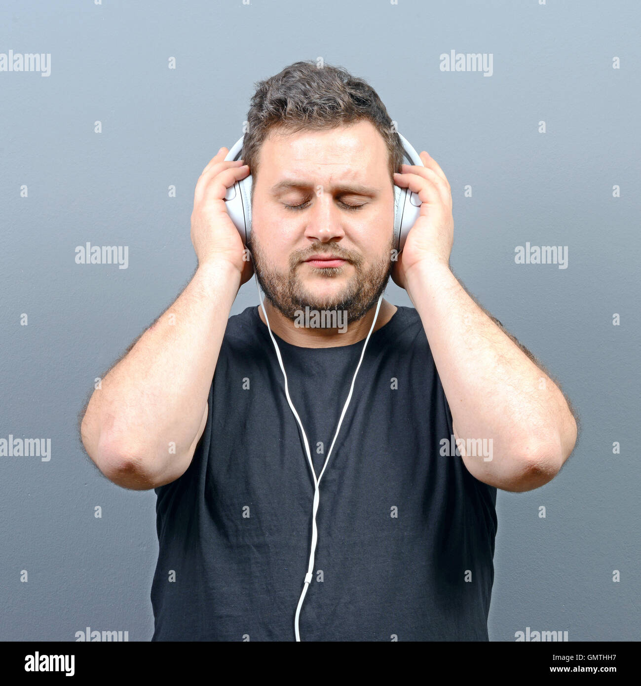 Chubby man enjoying music Stock Photo - Alamy