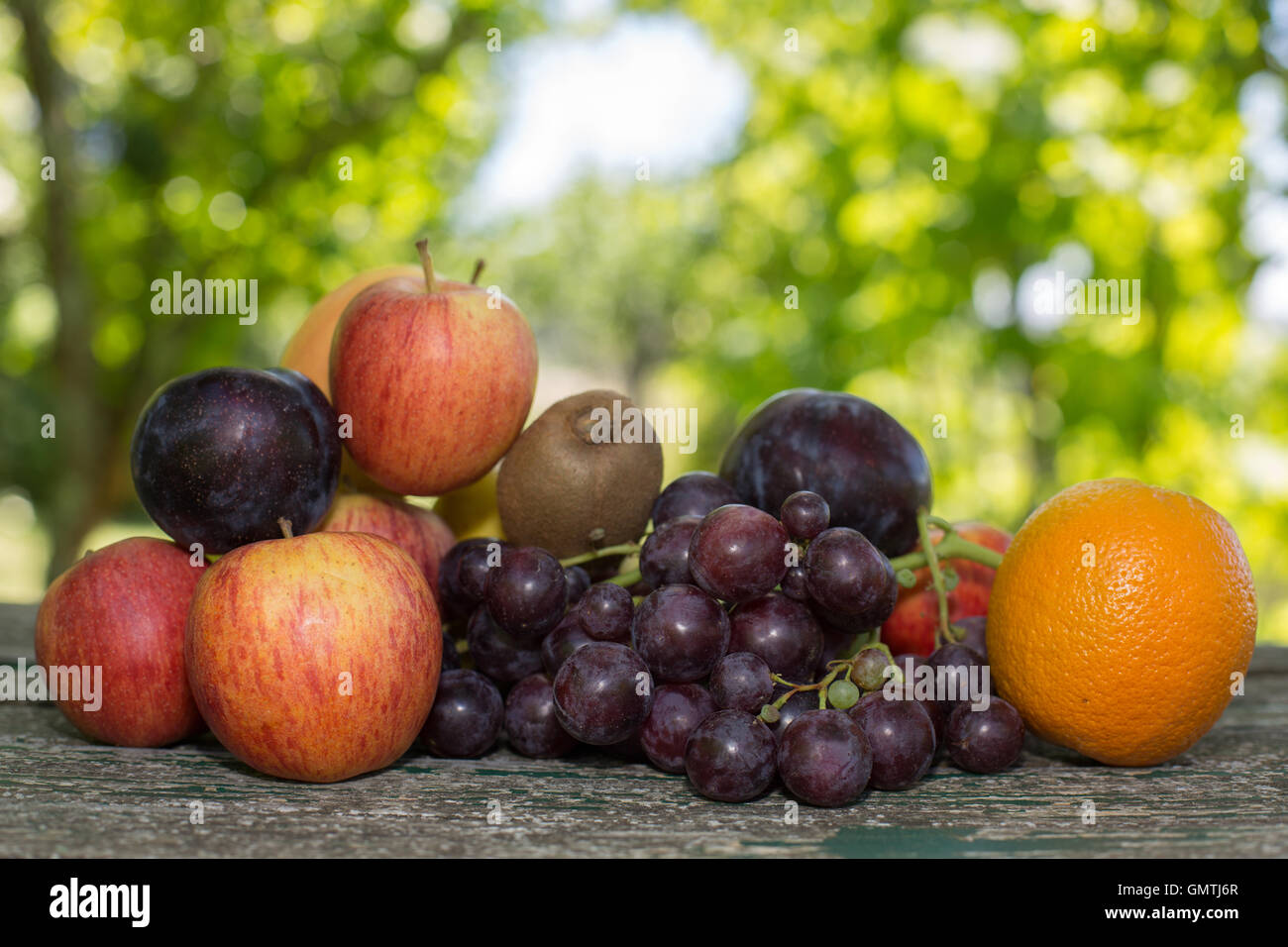 fruits in wooden table, outdoor Stock Photo - Alamy