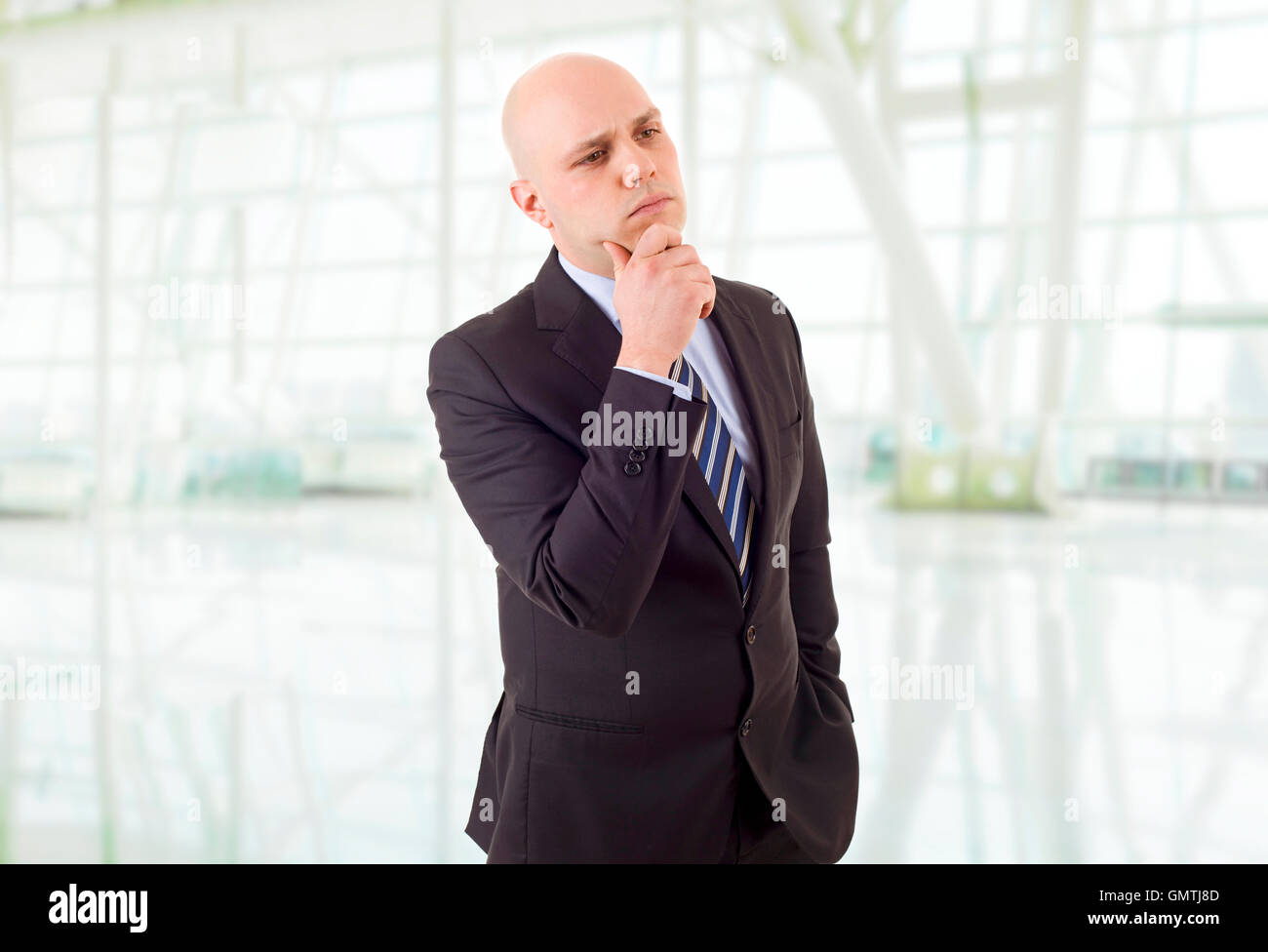 young business man thinking, at the office Stock Photo - Alamy