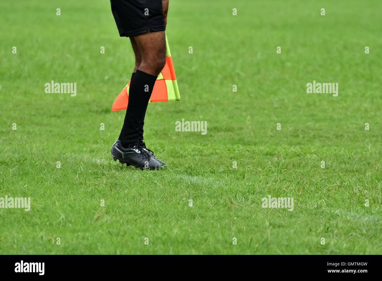 Assistant referee running along the sideline Stock Photo - Alamy