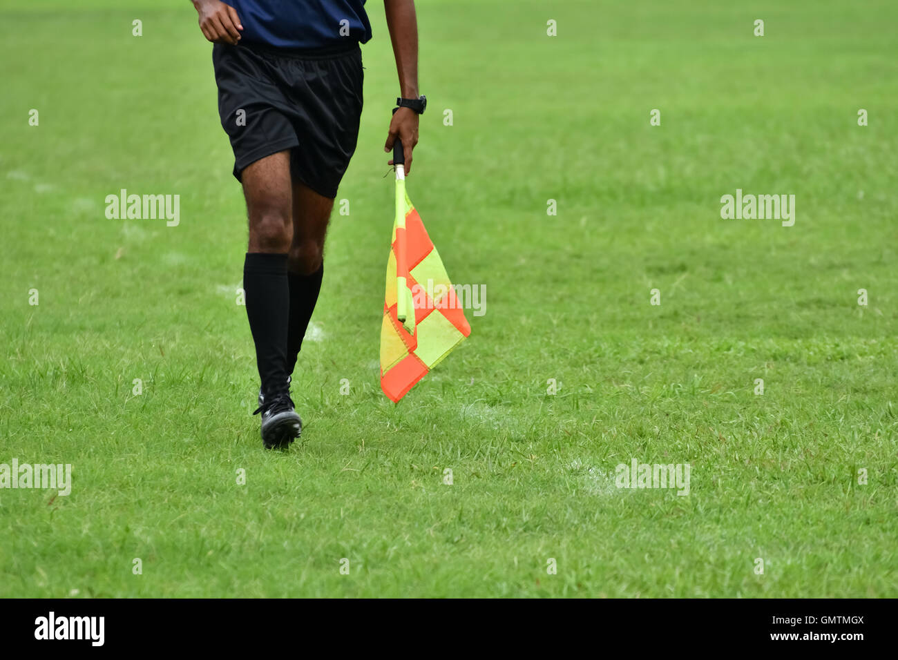 Assistant referee running along the sideline Stock Photo - Alamy