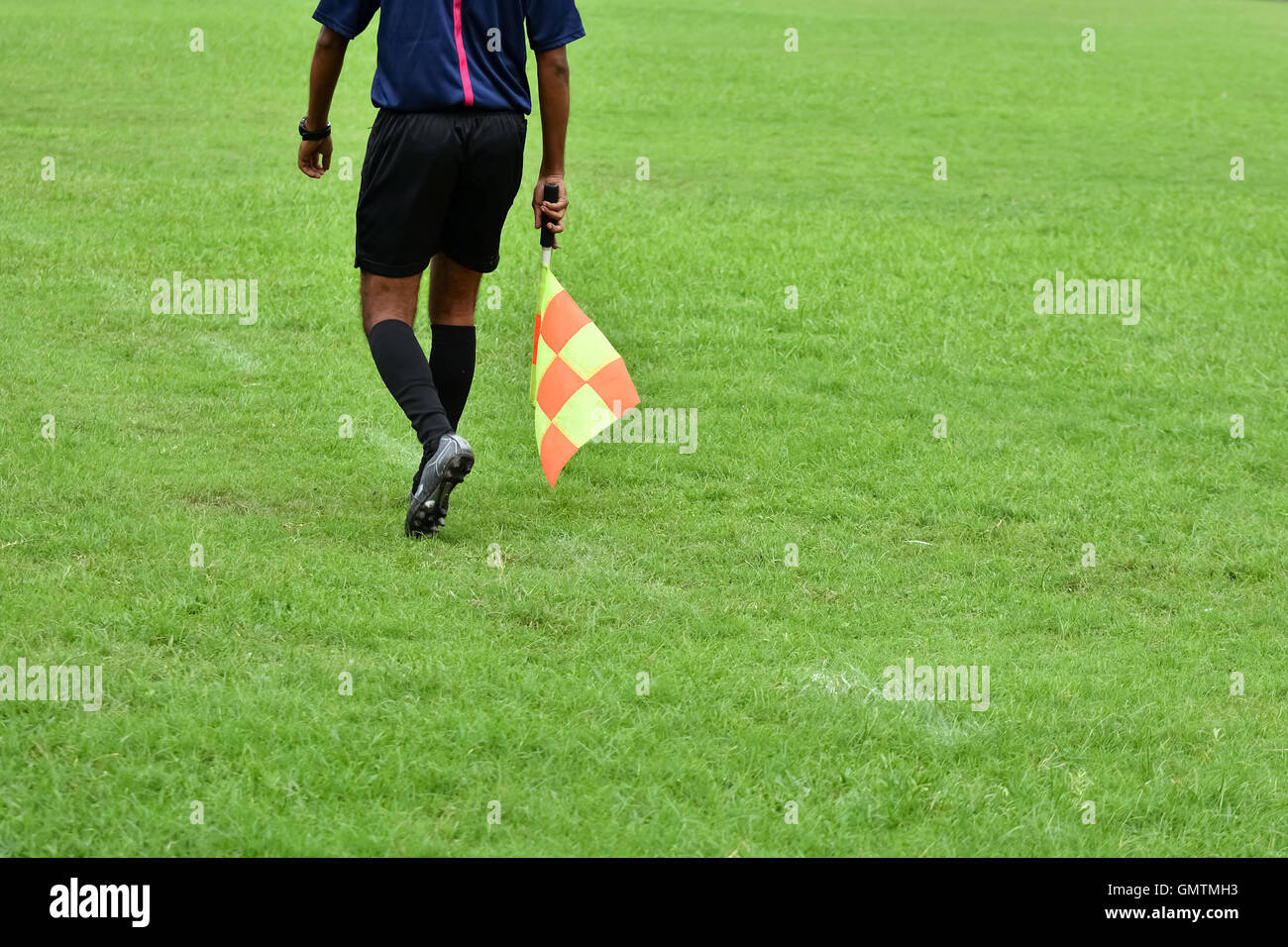 Assistant referee running along the sideline Stock Photo - Alamy