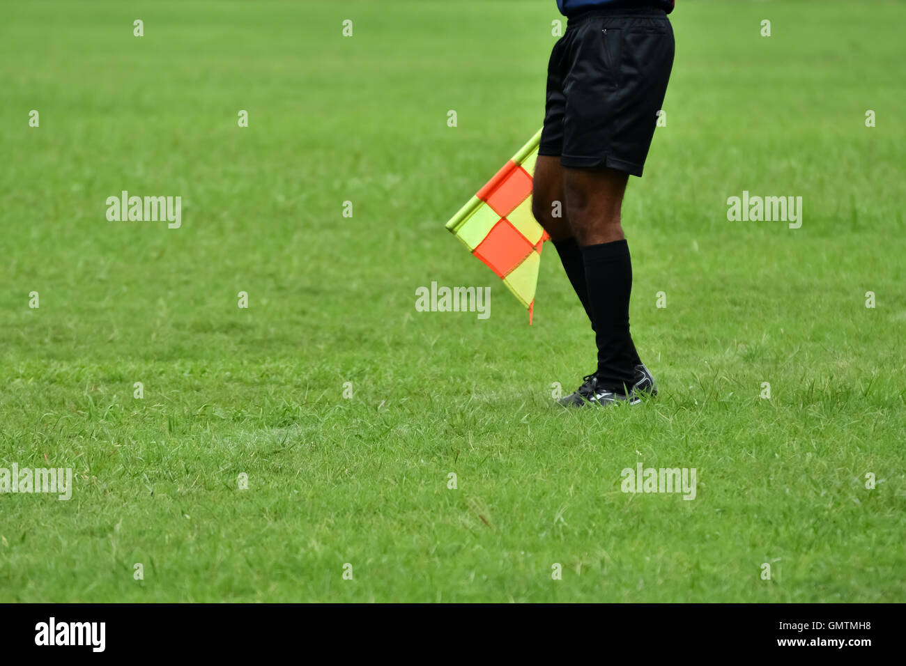 Assistant referee running along the sideline Stock Photo - Alamy