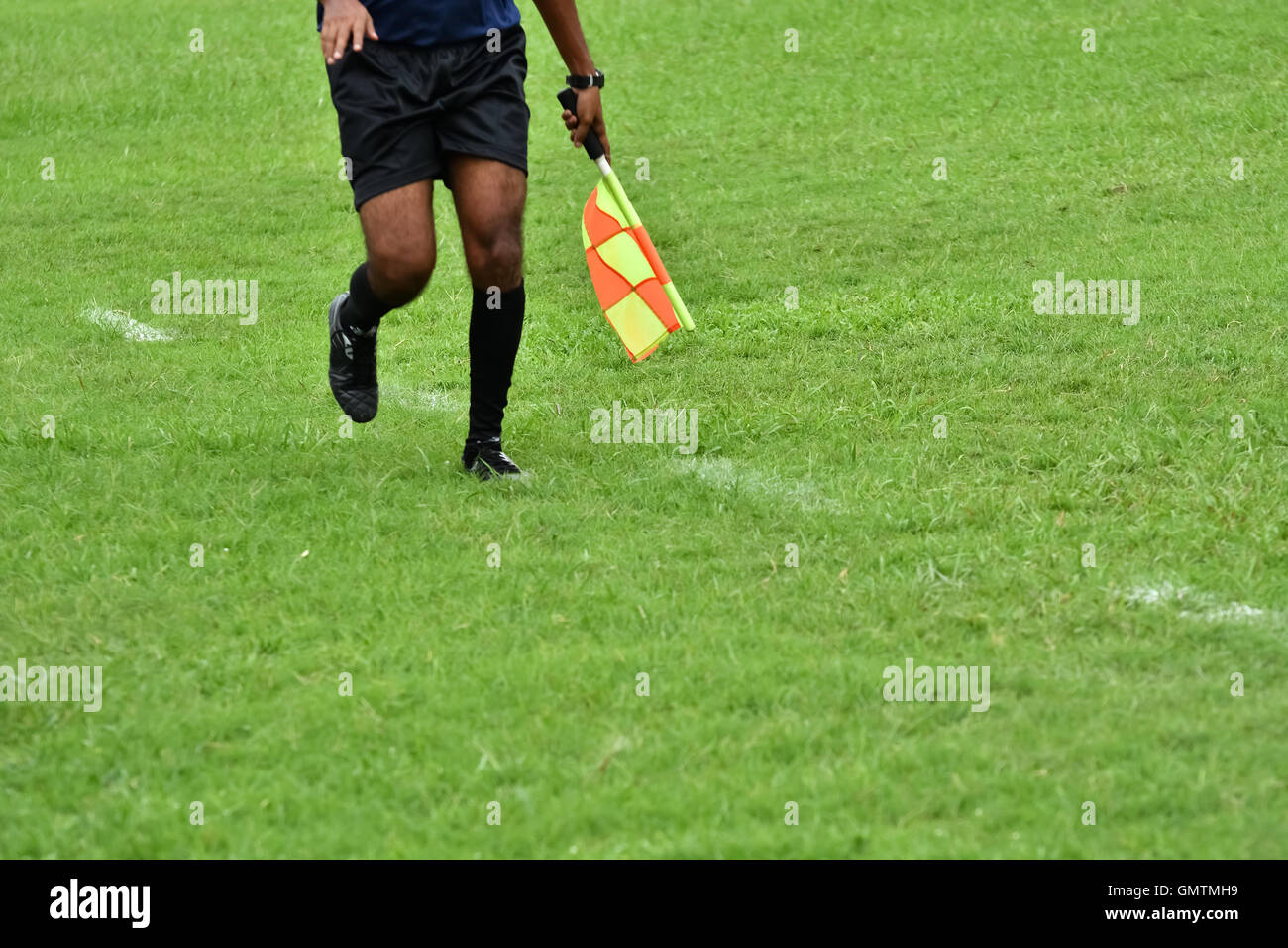 Assistant referee running along the sideline Stock Photo - Alamy