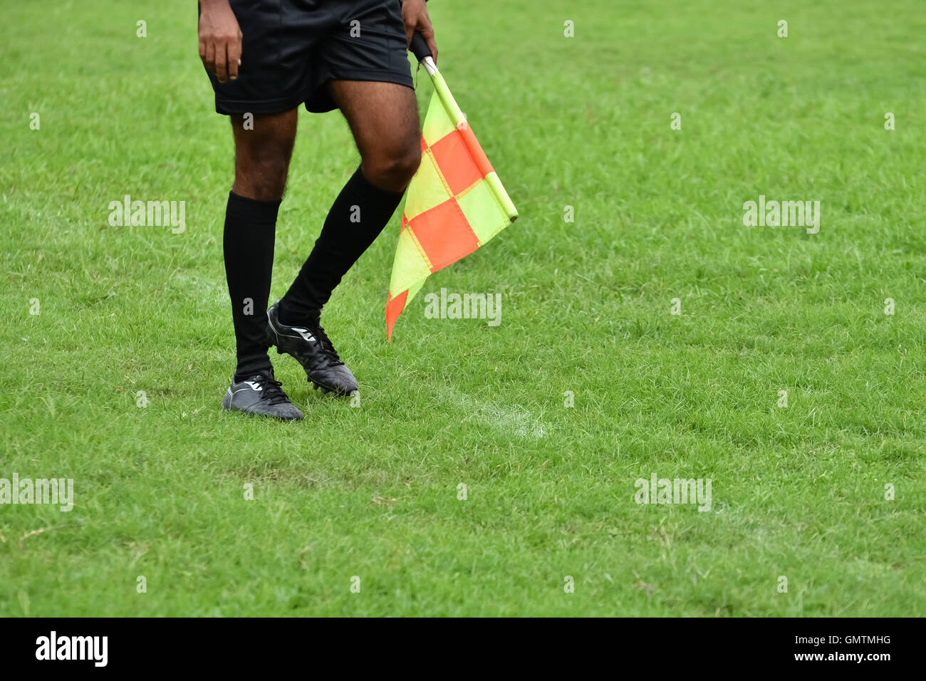 Assistant referee running along the sideline Stock Photo - Alamy