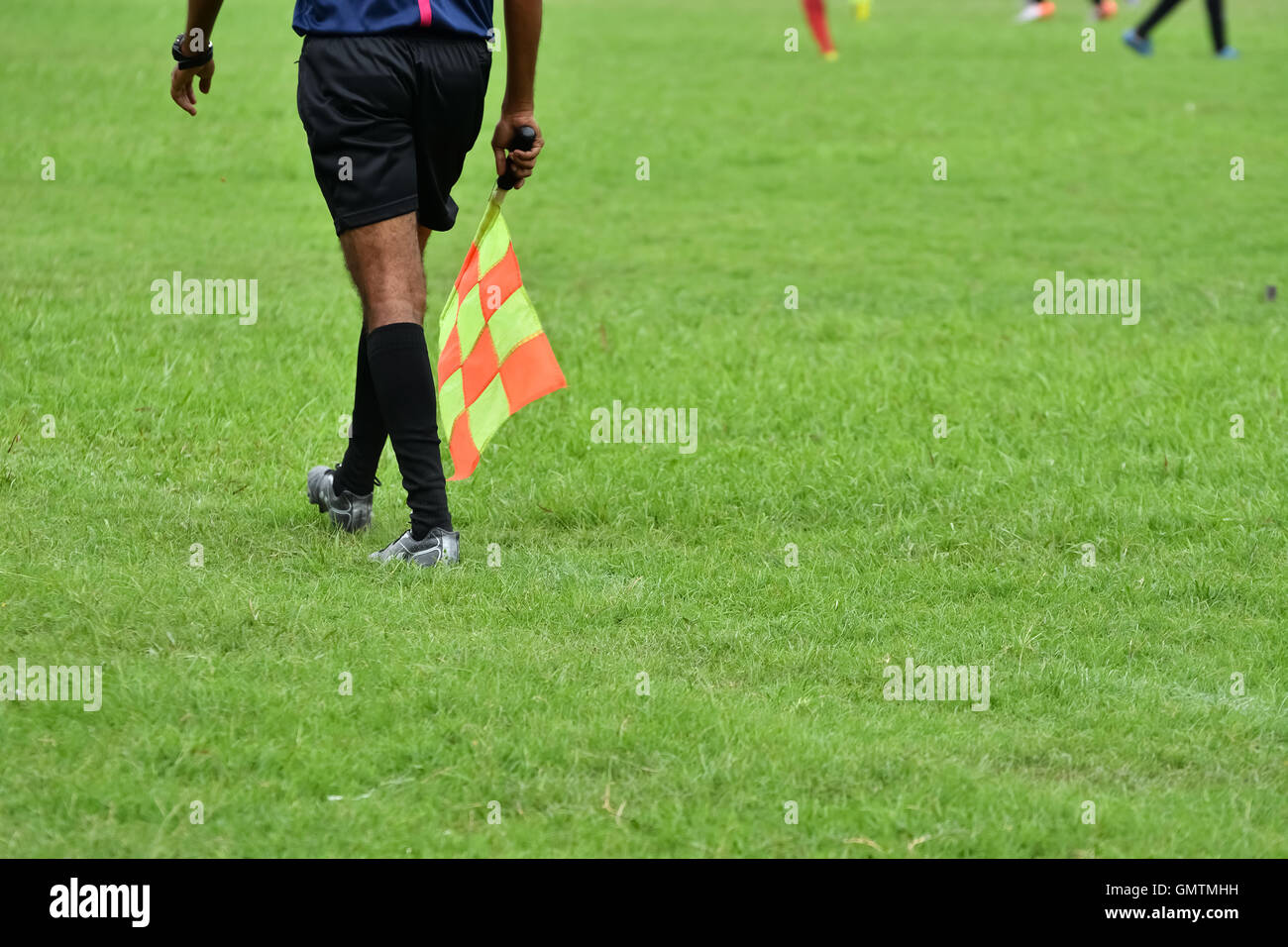 Assistant referee running along the sideline Stock Photo - Alamy