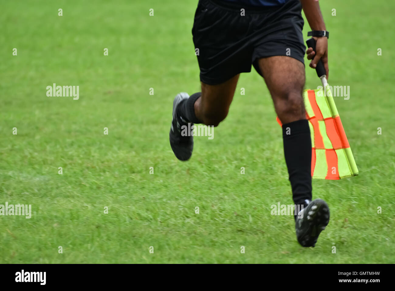 Assistant referee running along the sideline Stock Photo - Alamy