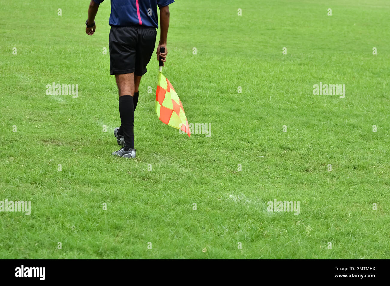Assistant referee running along the sideline Stock Photo - Alamy