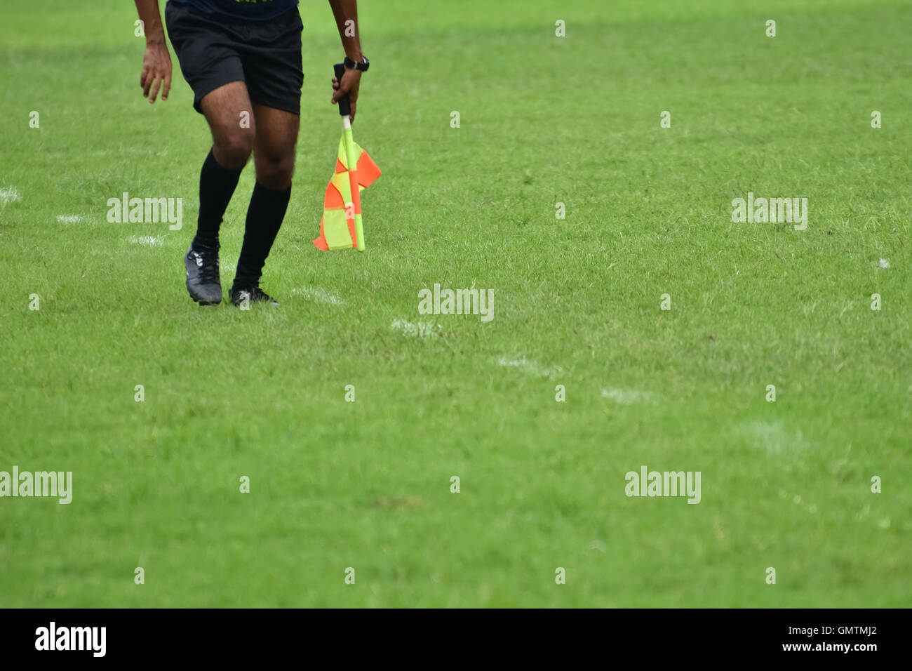 Assistant referee running along the sideline Stock Photo - Alamy