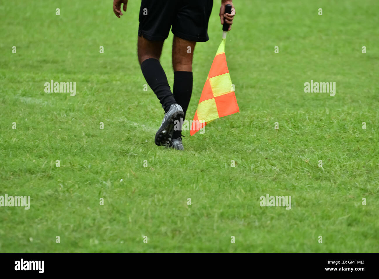 Assistant referee running along the sideline Stock Photo - Alamy