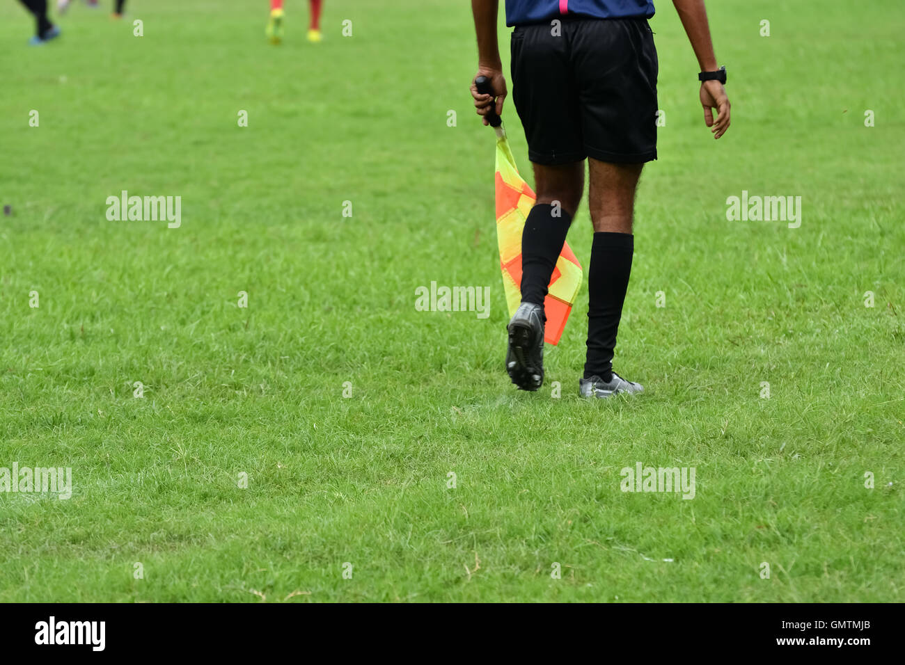 Assistant referee running along the sideline Stock Photo - Alamy