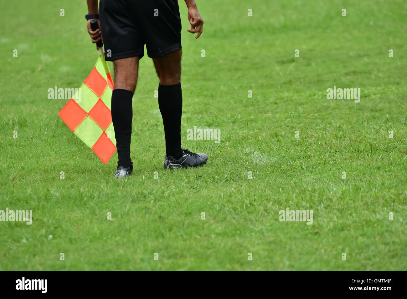 Assistant referee running along the sideline Stock Photo - Alamy