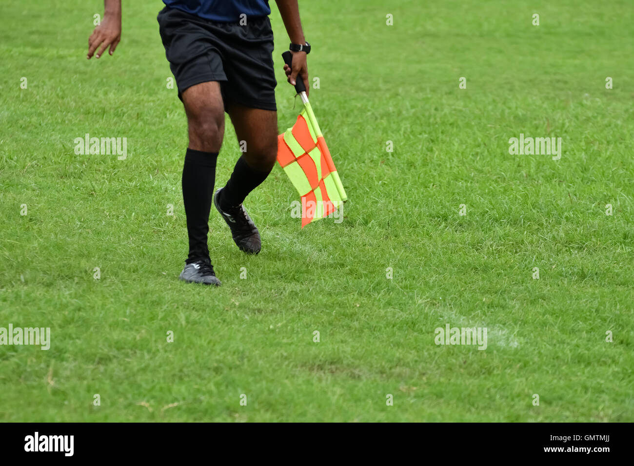 Assistant referee running along the sideline Stock Photo - Alamy