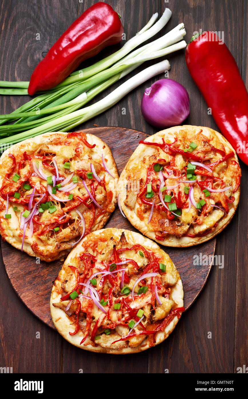 Meat pizza with chicken and vegetables, top view Stock Photo - Alamy