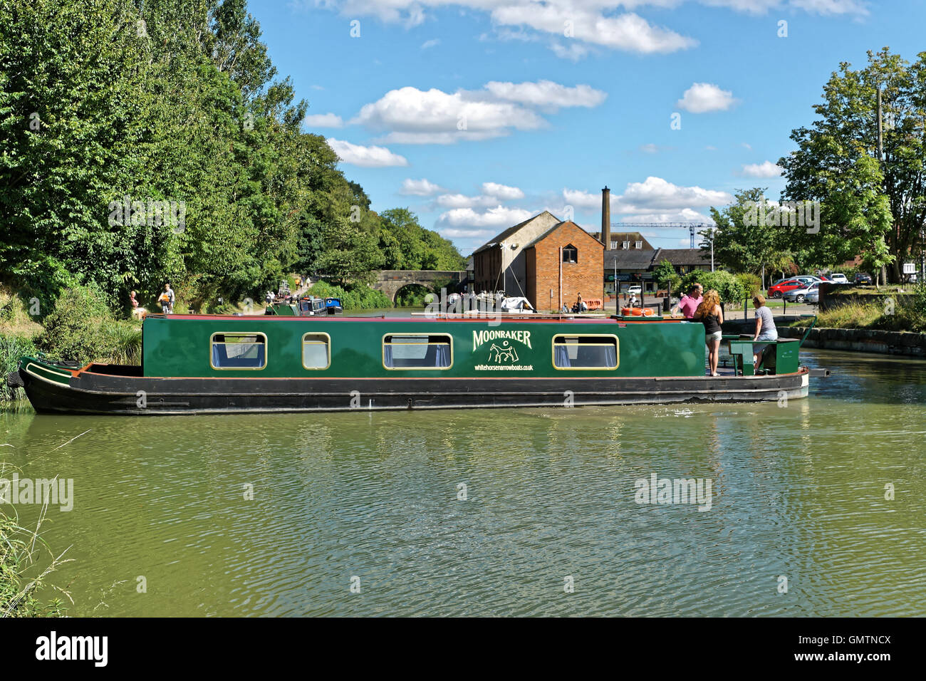 narrowboat turning in a winding hole on Canal Stock Photo - Alamy