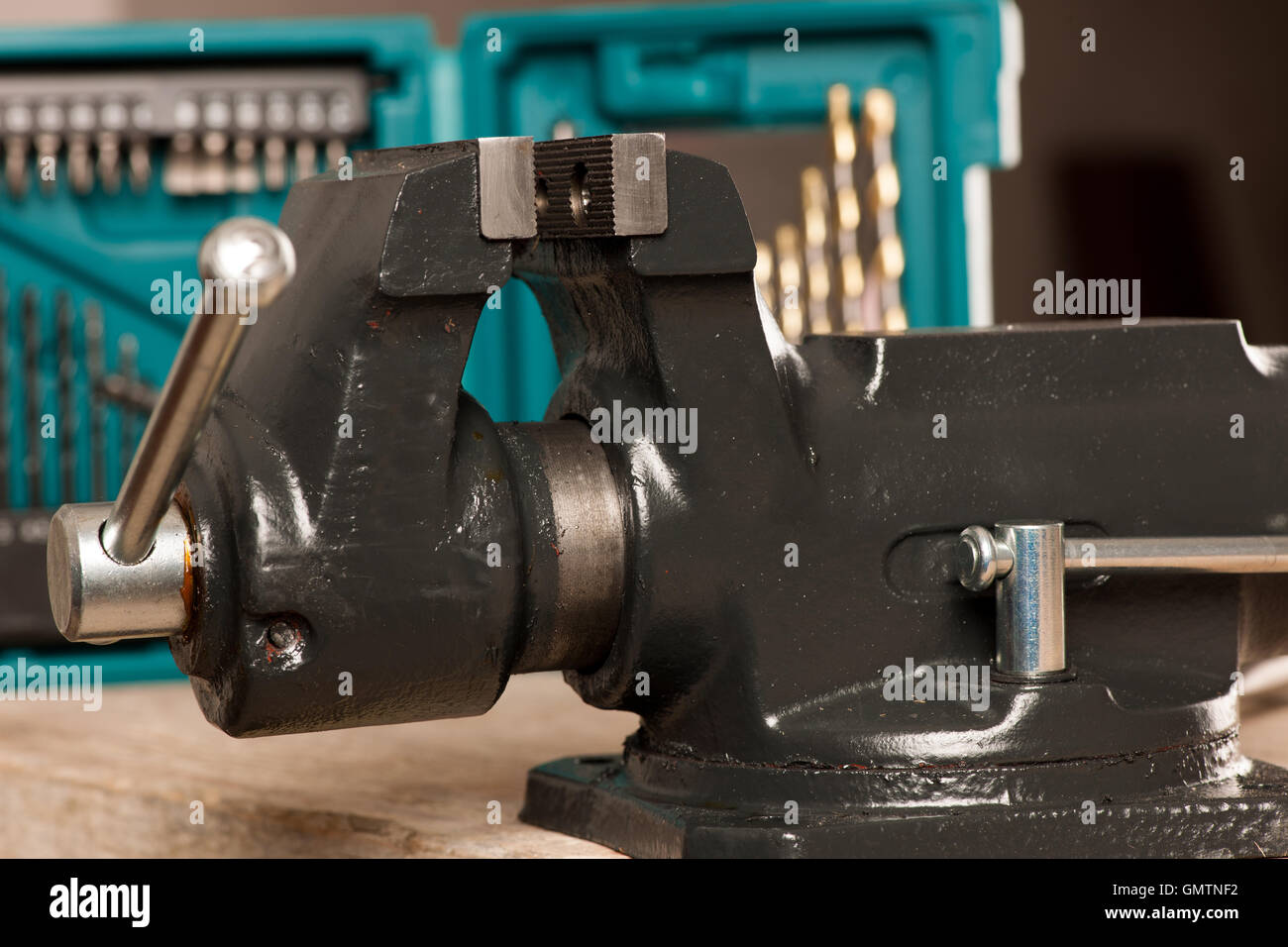 Closeup of vice tool clamping device on wooden background Stock Photo ...