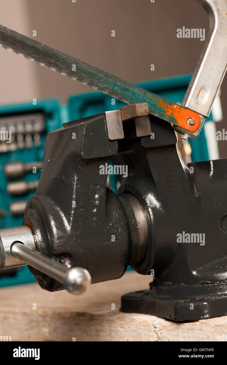 Cutting iron with saw on vice tool, clamping device Stock Photo - Alamy
