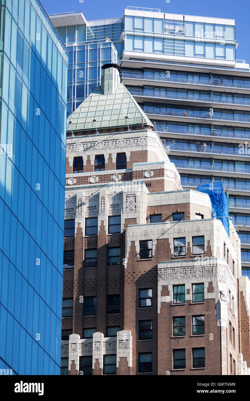 Historic and modern skyscrapers standing next to each other in ...