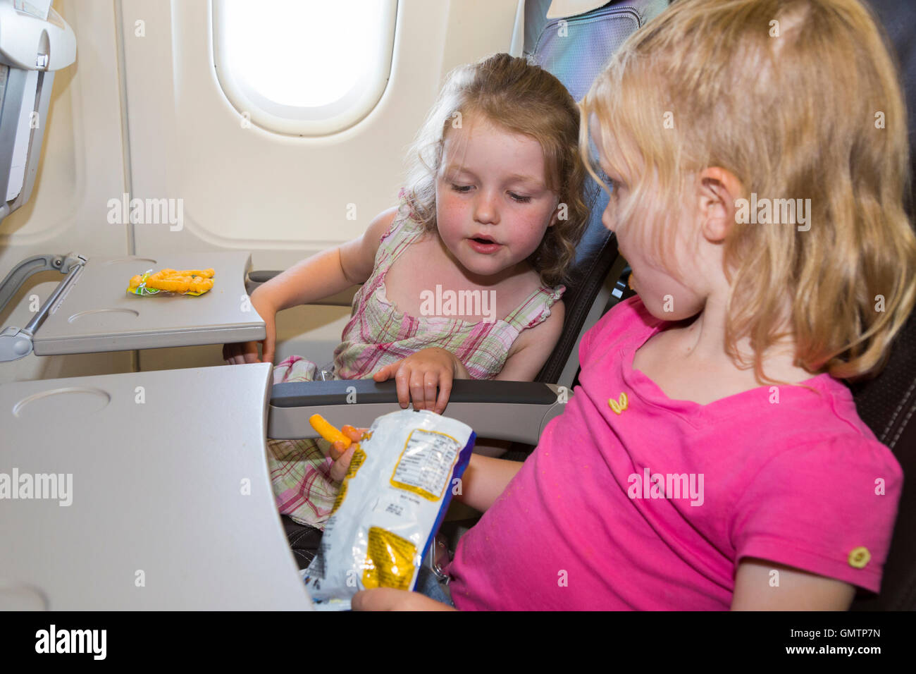 Child airplane eating hi-res stock photography and images - Alamy