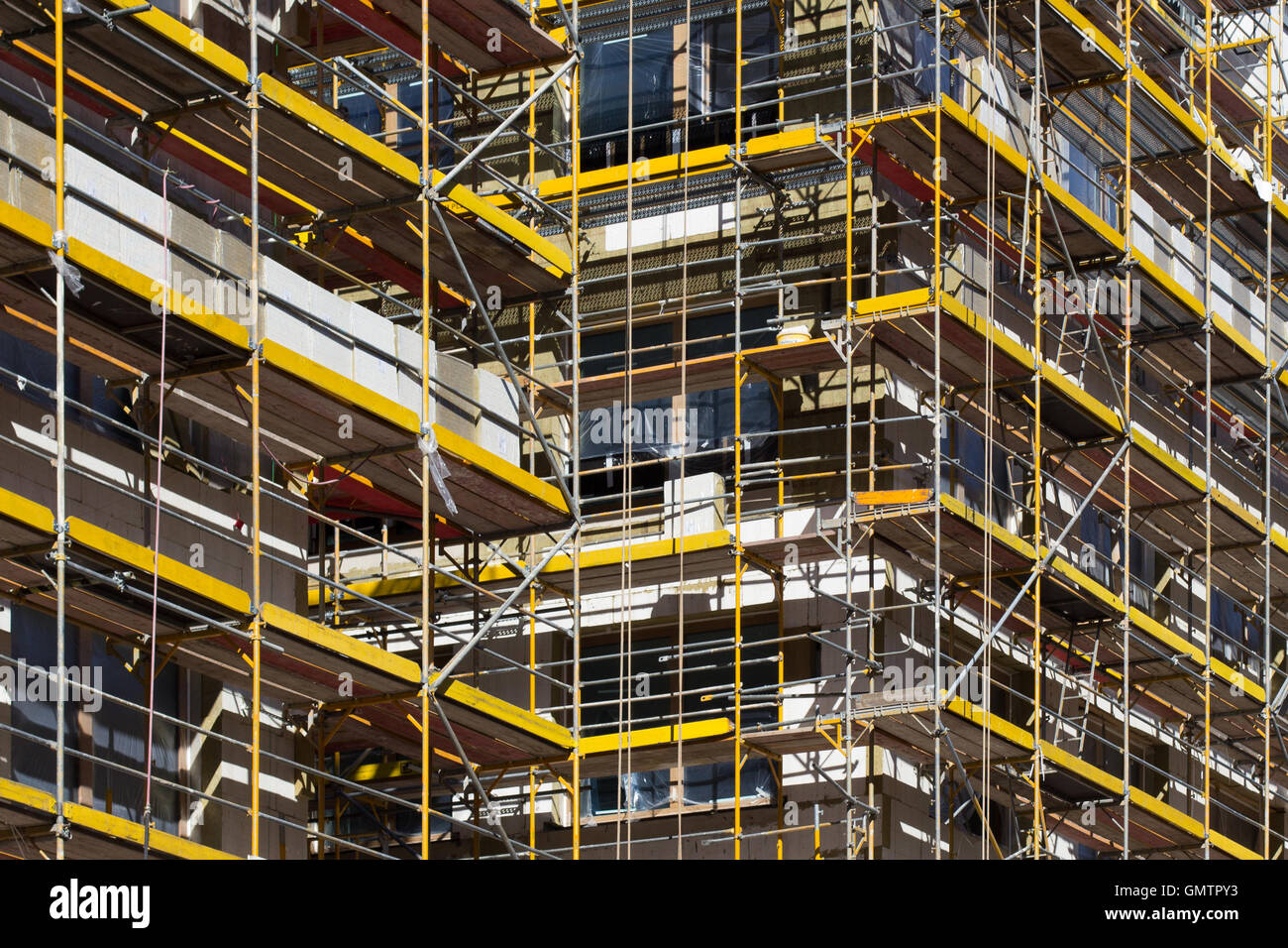 scaffolding on building - building facade with scaffolds Stock Photo ...
