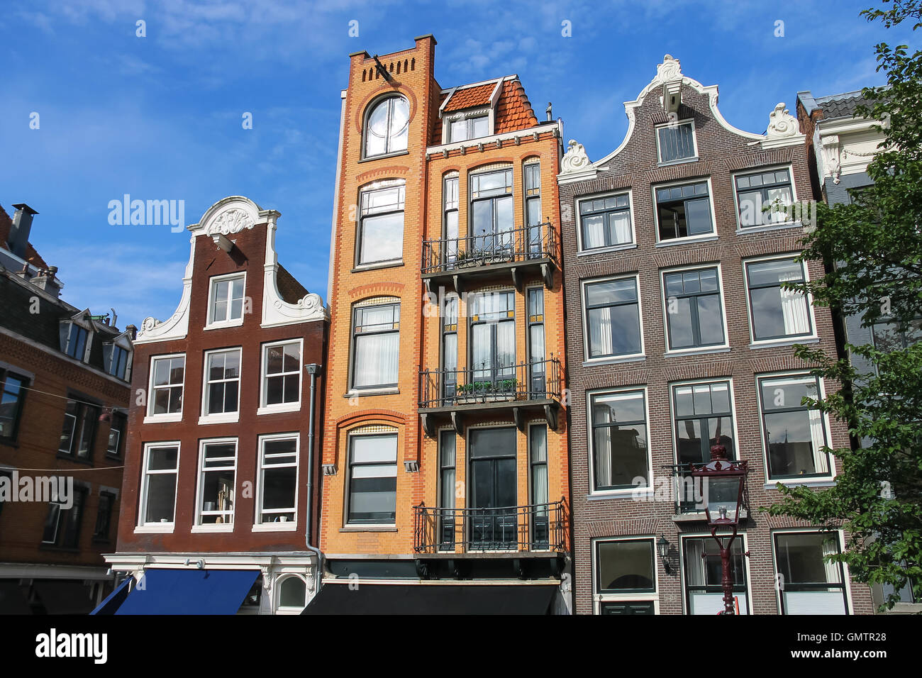 Houses in the classic Dutch style in historic city centre. Amsterdam ...