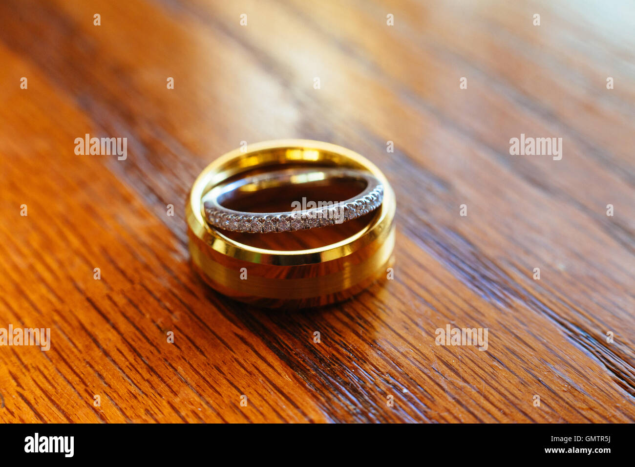 Wedding rings closeup on a pattern background Stock Photo - Alamy
