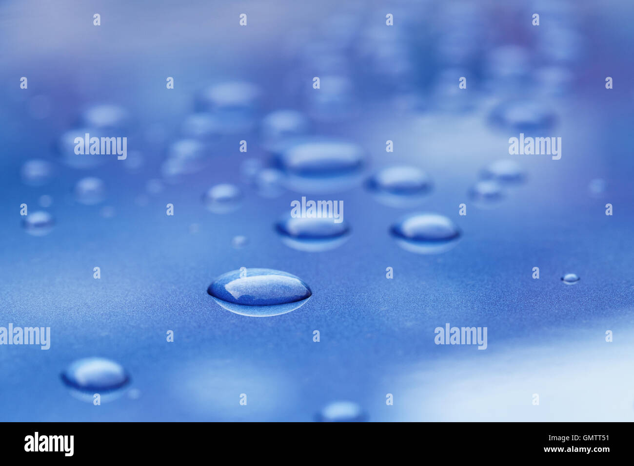 water drops on blue car body threated with protective coating Stock ...