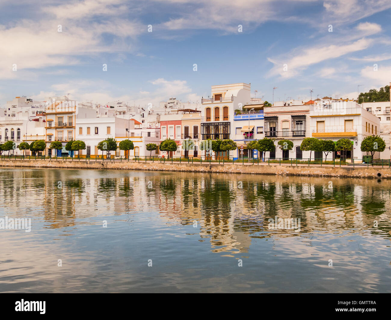 Traditional white architecture of the region along the riverbank in ...