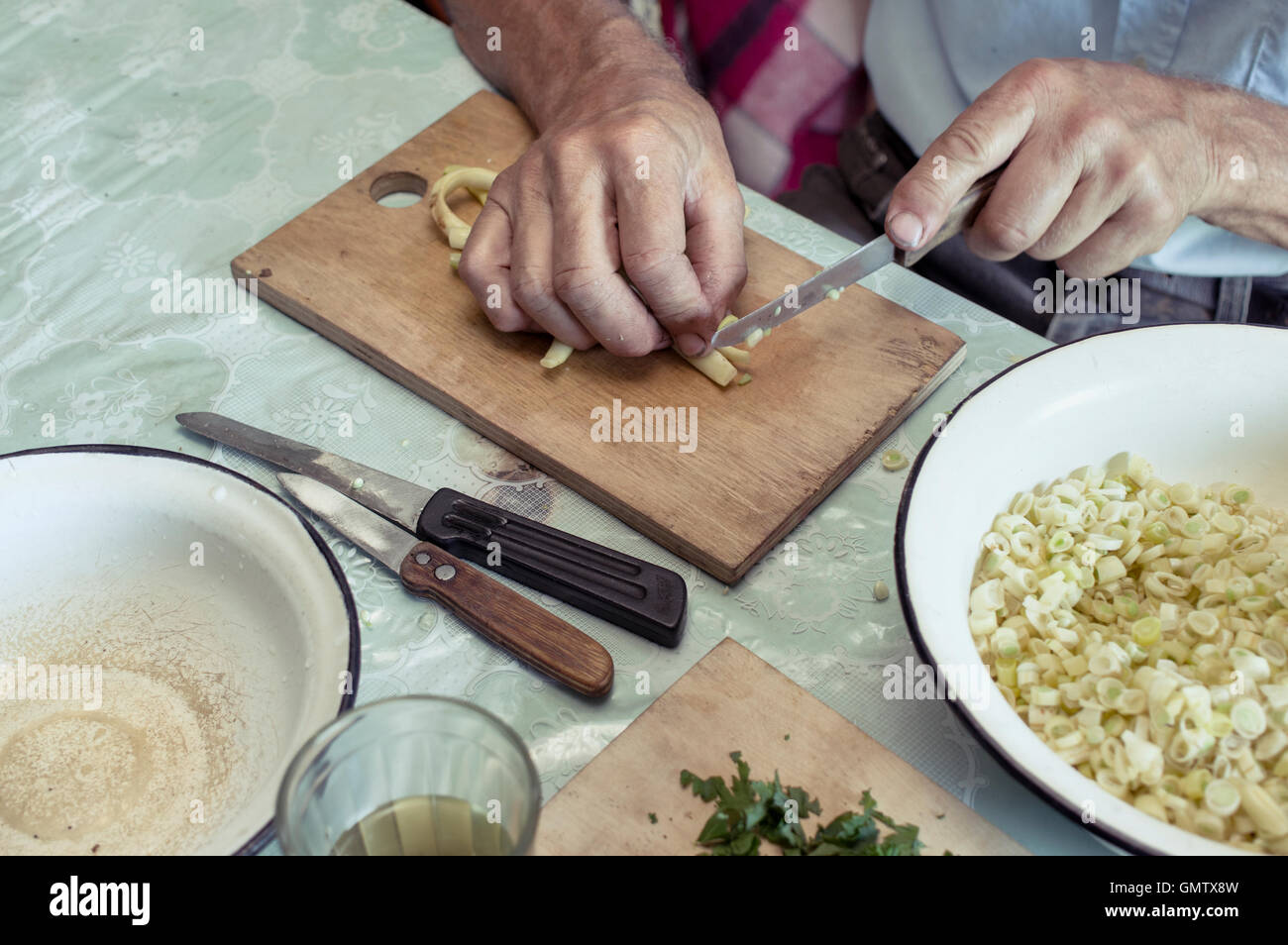 Man Chopping Beans Stock Photo - Alamy