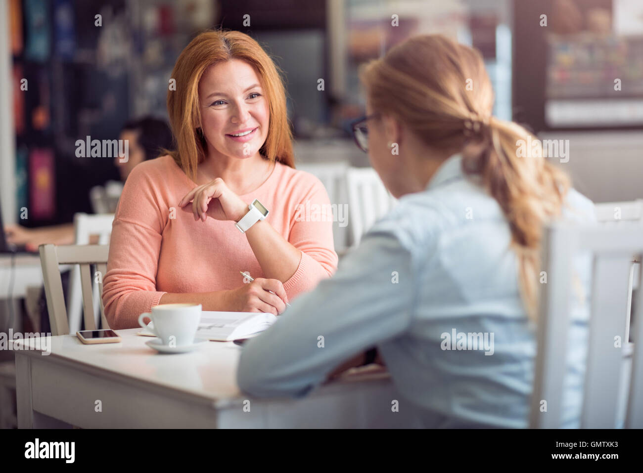 Positive woman conducting an interview Stock Photo - Alamy